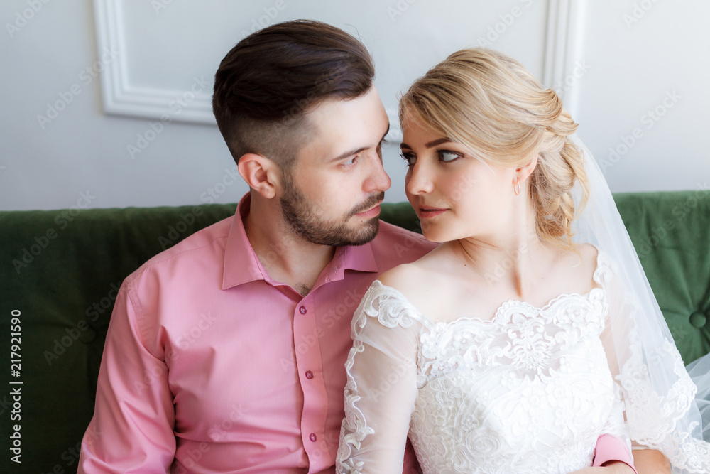 Happy wedding couple hugging and kissing. Beautiful young bride and ...