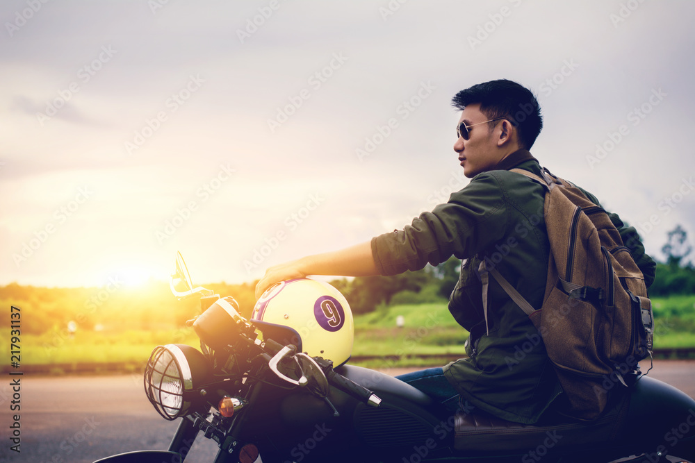 Biker man and motorcycle with river background, Rider moto trip on the ...