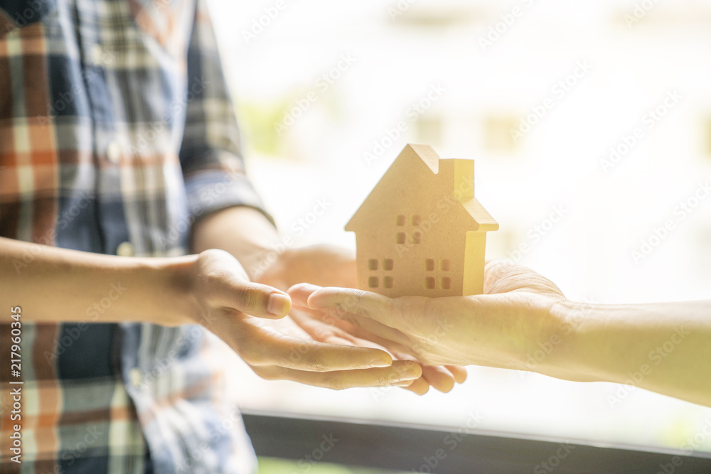 Owner of home signing contract after architect build home finish ...