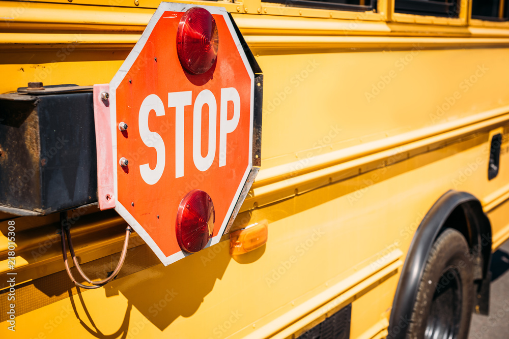 partial view of school bus with stop sign Stock Photo | Adobe Stock