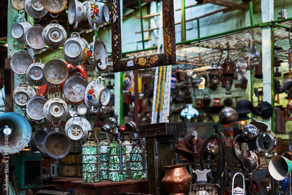 Vintage kitchen utensils. Various old objects for sale at a indoor flea ...