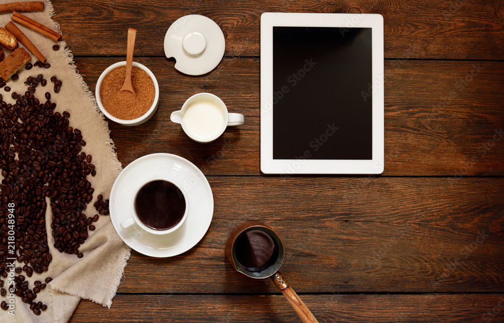 Coffee background. White tablet computer blank black screen with white ...