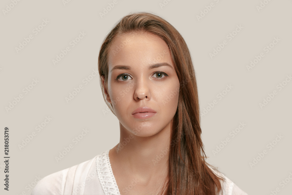 Serious business woman isolated on gray studio background. Beautiful ...