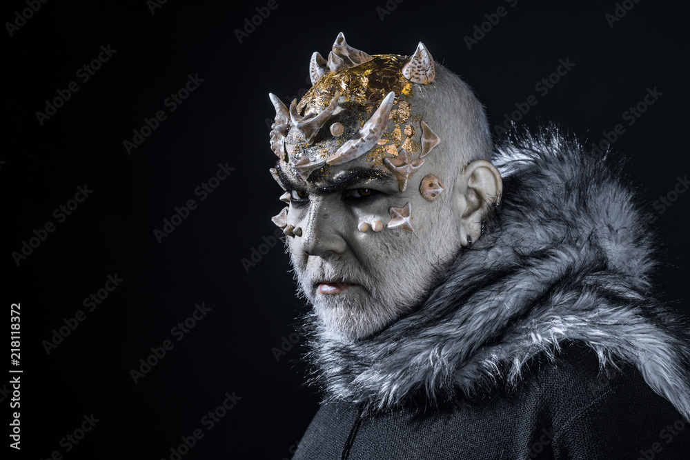 Alien, demon, sorcerer makeup. Demon on black background, copy space ...