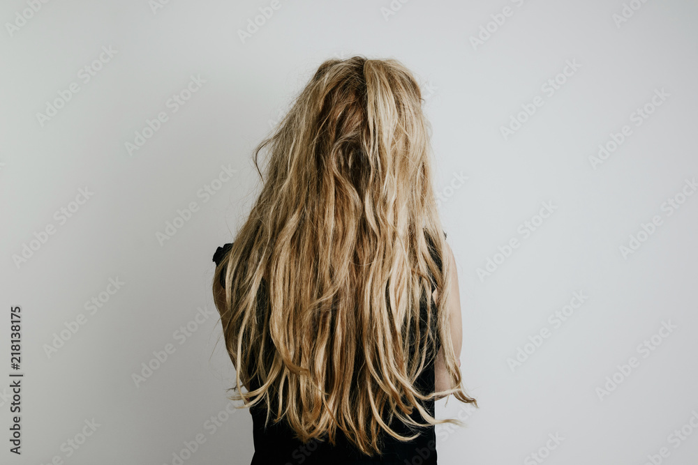 A view of the hair from the back of a woman, a girl's figure isolated ...
