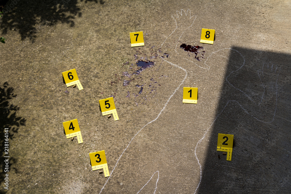 Crime scene. Shape of body on concrete texture. In the background blood ...