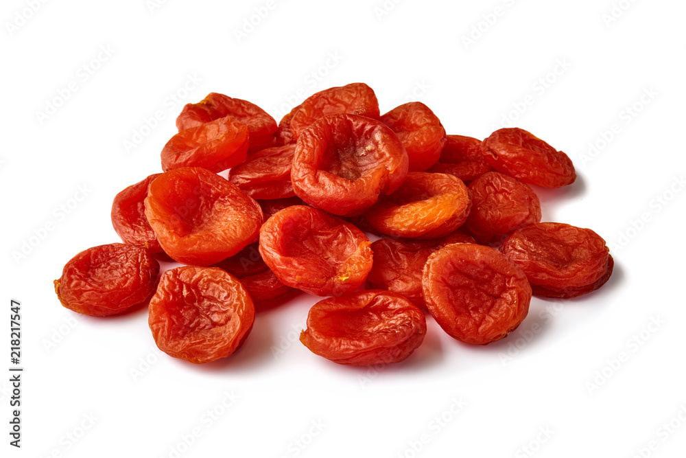 Heap of dried apricots isolated on white background. Fruit dried in the ...