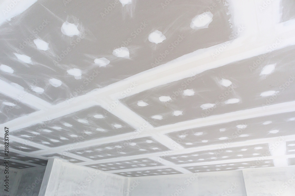 ceiling gypsum board installation at construction site Stock Photo ...