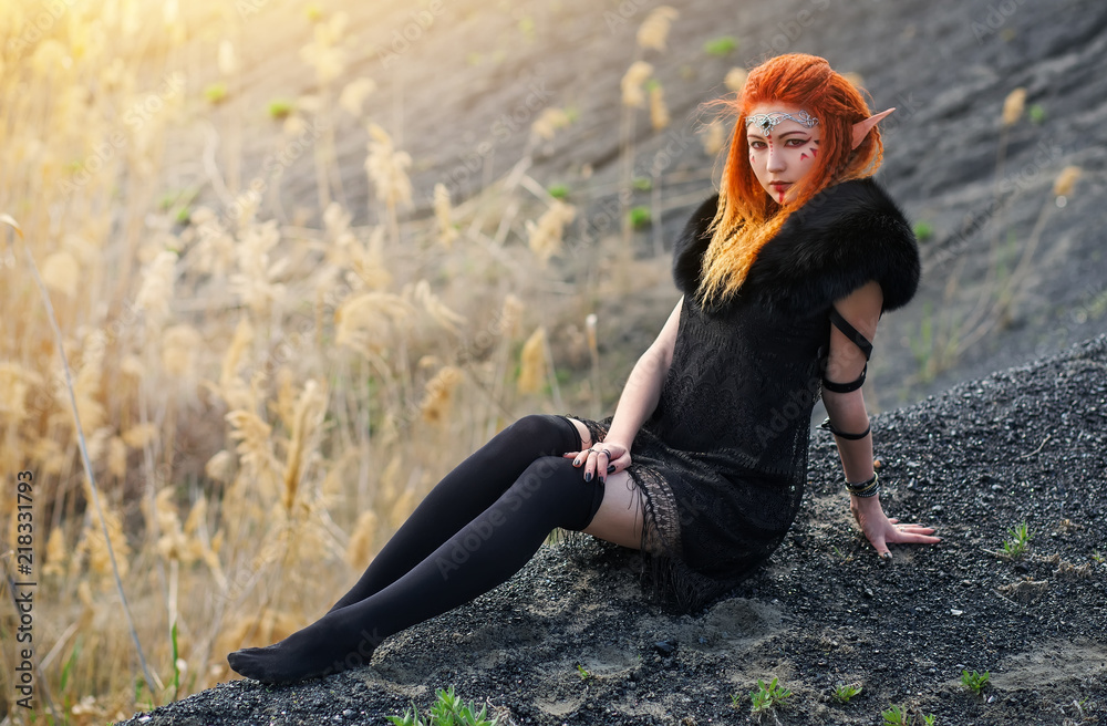 Elf women with fiery hair on nature. Beautiful young fantasy girl ...