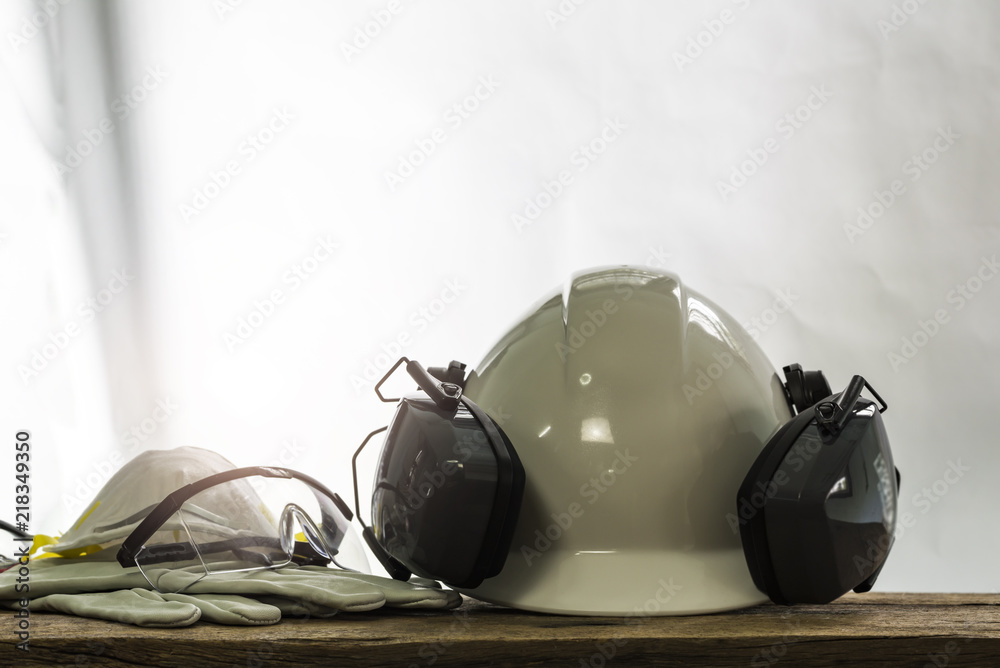 PPE onsist with White safety helmet (hard hat) with ear muff attached ...