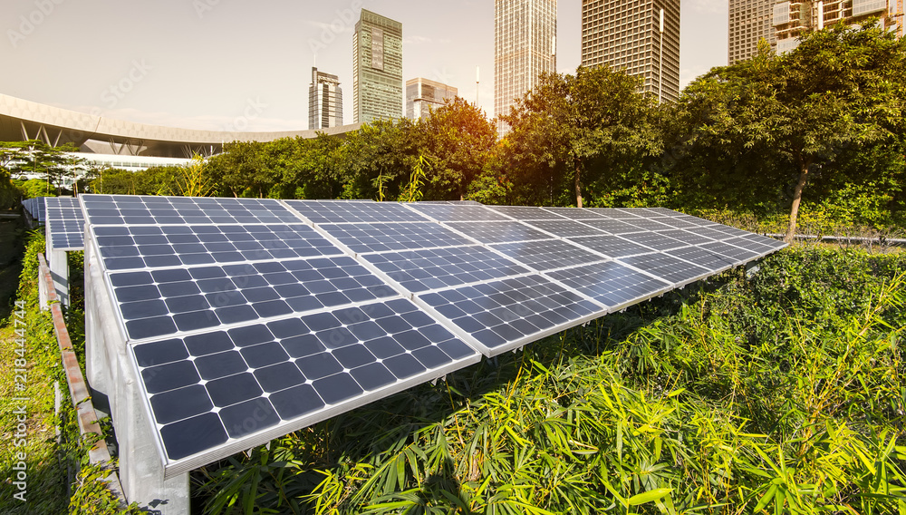 solar panel with skyscrapers of in blue cloud sky,Green city of the ...