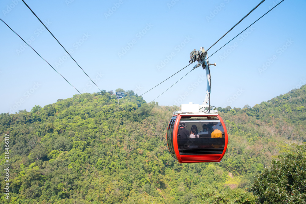 red cable car for transport and passenger running over mountain and ...