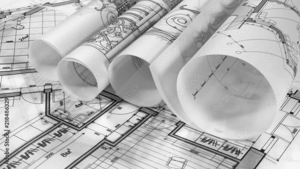 Blueprints - rolls of architectural drawings smoothly rotate on the ...