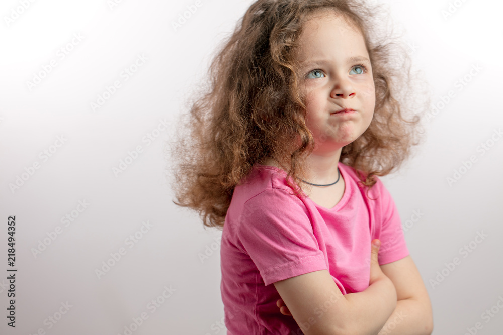 angru red-haired girl with frawning eyebrows is taking offence. anger ...