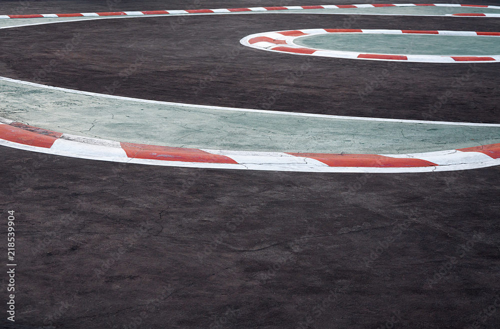 Curving asphalt red and white kerb of a race track detail,Motorsports ...
