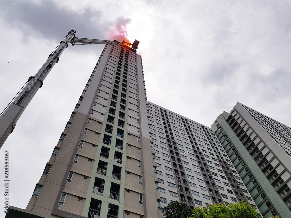 Firefighter rescue training people in hight-rise building to escape by ...