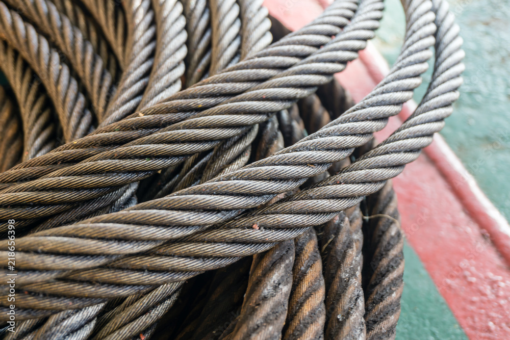 Wire rope sling being used as anchor pennant wire coiled on deck of a ...