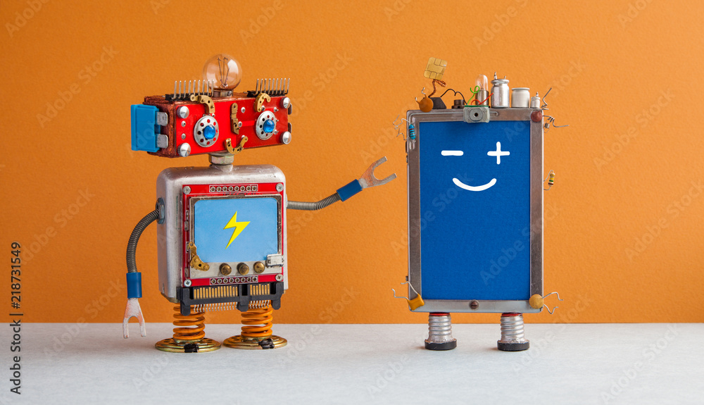 Smiley robot and cellular mobile phone. Robotic toy characters ...
