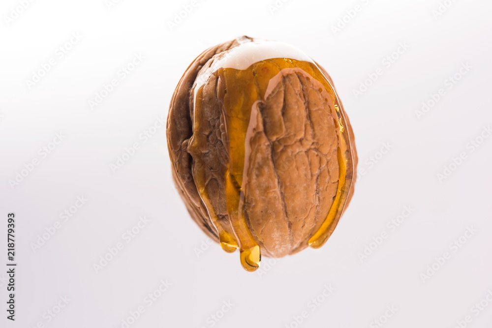 Golden walnut oil drop dripping fromnwhole Akrod/akhrot dry fruit ...