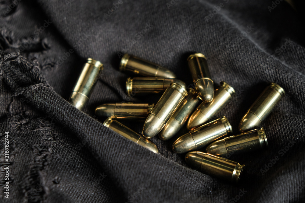 Full metal jacket 9mm ruger bullet on cloth texture Stock Photo | Adobe ...