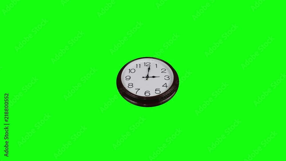 Clock with a round dial on a green screen. Time concept. The hands make ...