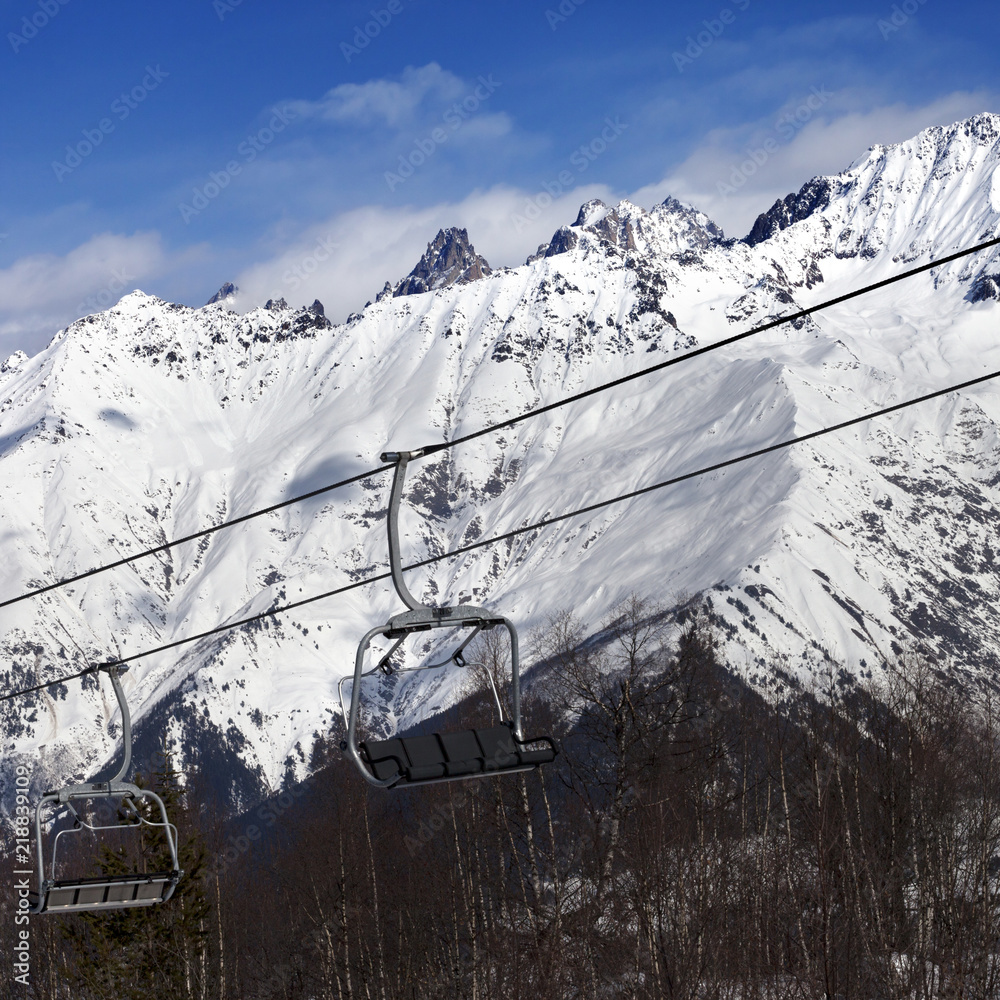 Ski resort with chair lift and snow mountains at nice sunny day Stock ...