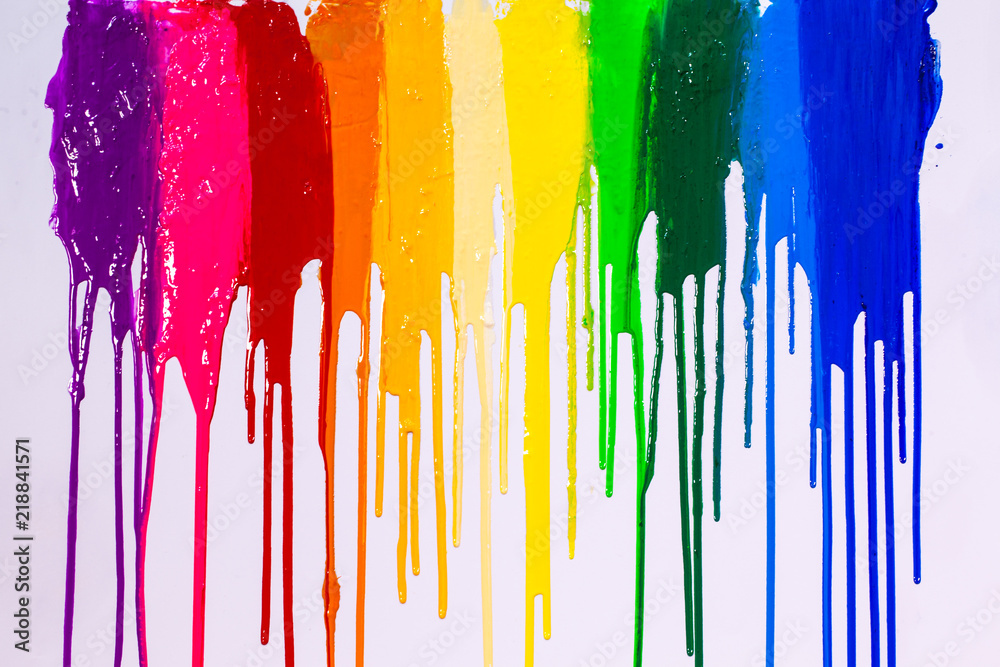 rainbow cilors of screen print colors are dripping in white background ...
