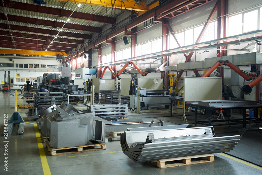 Wide angle background shot of empty factory workshop with machines ...