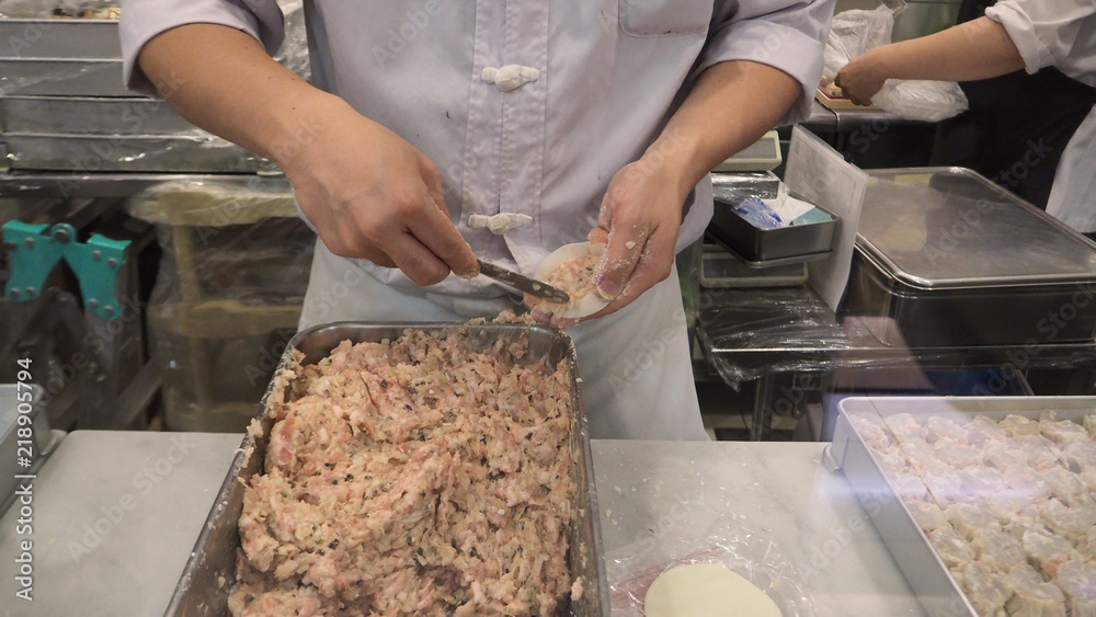 Blurry image of Man or chef is making dim sum. by dumpling wrappers ...