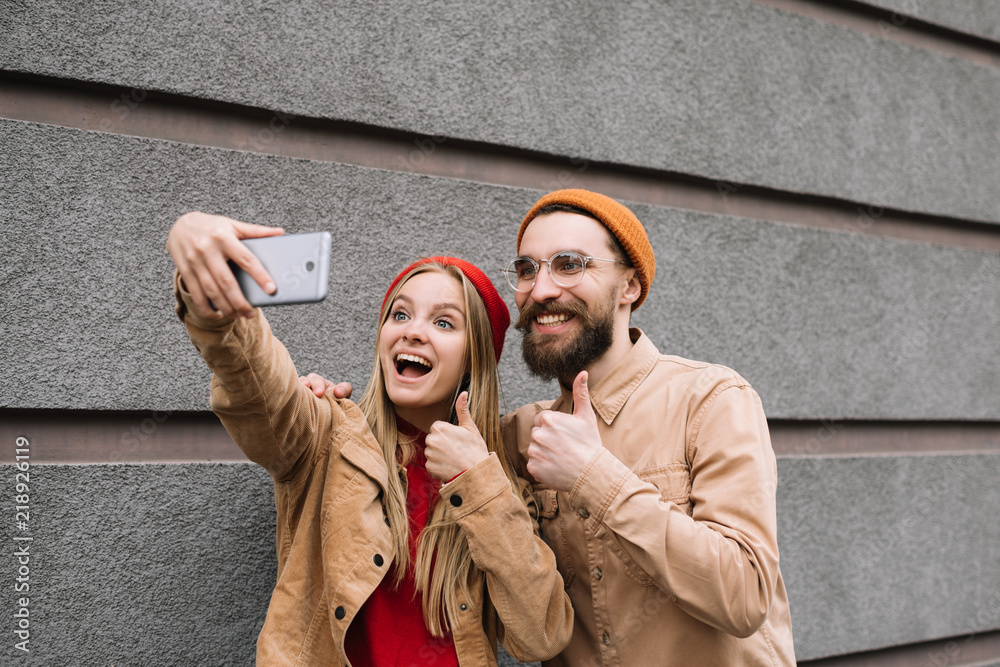 Positive And Smiling Hipsters Friends Taking Selfies Together Thump Up