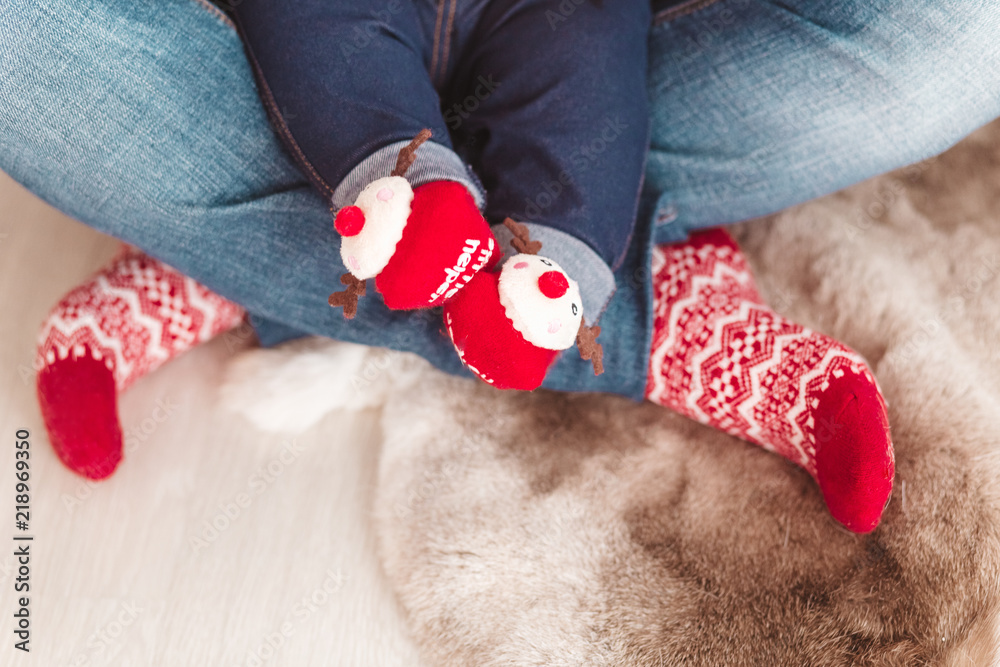 Feet in socks with a Christmas ornament.Holidays and Christmas with ...
