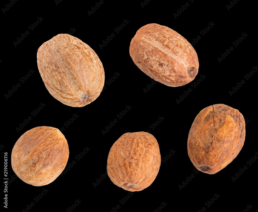 nutmeg isolated in black Stock Photo | Adobe Stock