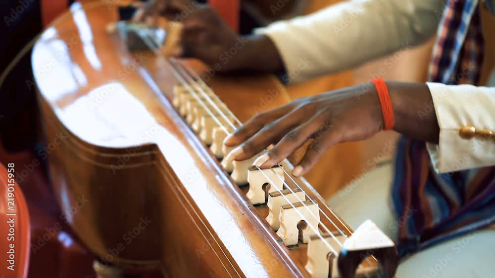 Cambodian man plying on traditional Khmer instrument called Chakhe ...