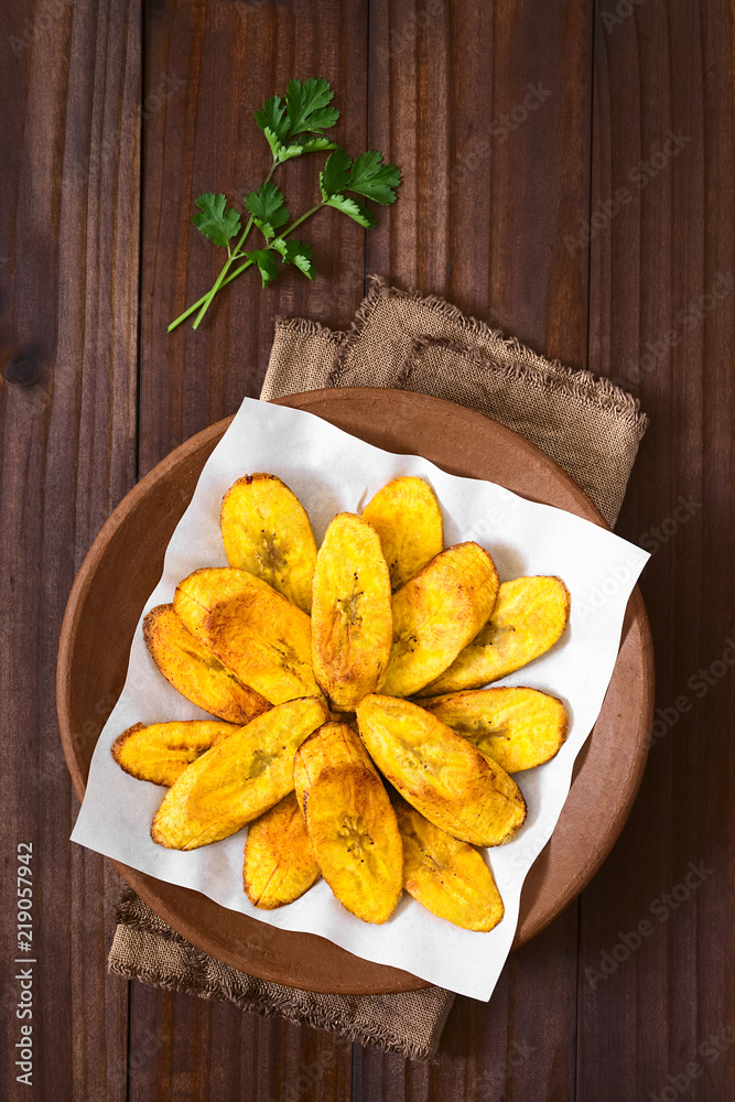 Fried slices of ripe plantains, a traditional and popular snack and ...