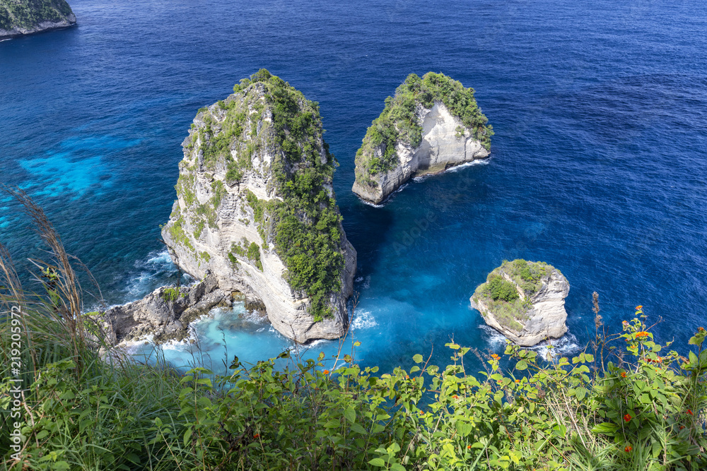 Tiny islands, part of the Raja Lima islands off the coast of Nusa ...
