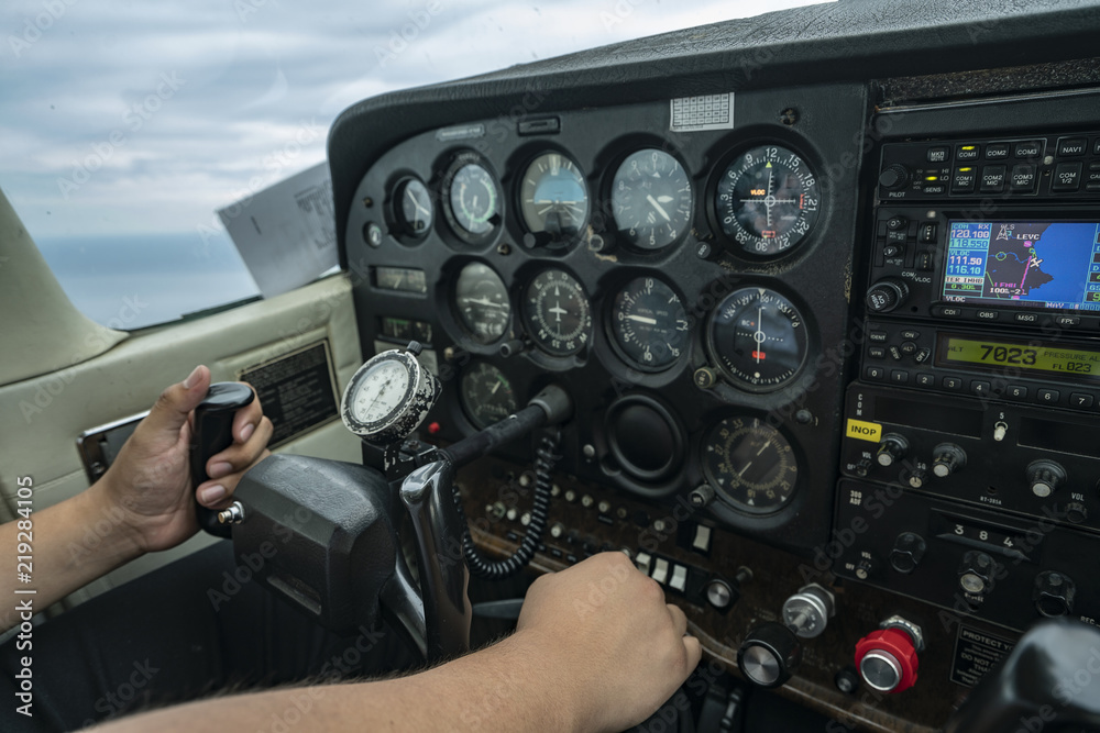 Pilot flying light aircraft. Stock Photo | Adobe Stock