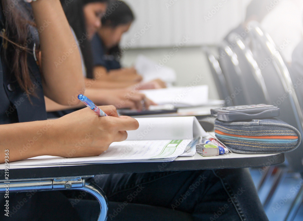 Hands university student holding pen writing /calculator doing ...