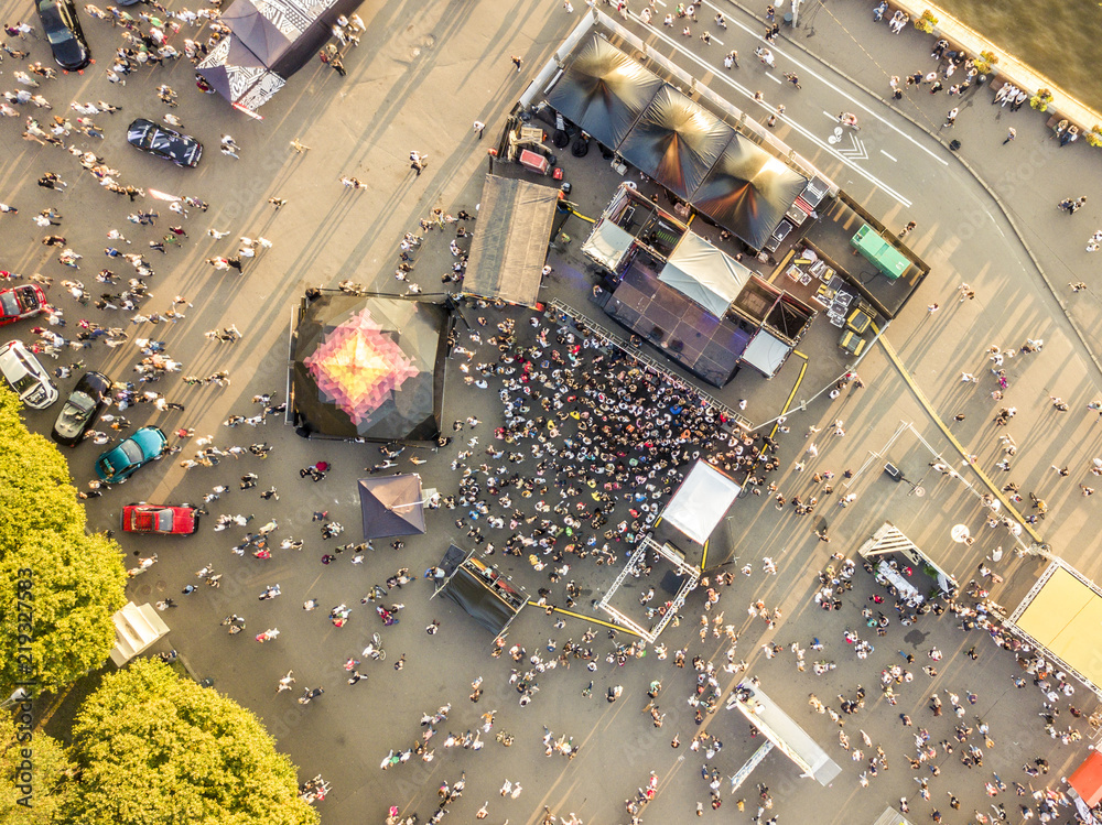 aerial top view of crowd of people standing near the stage on concert ...