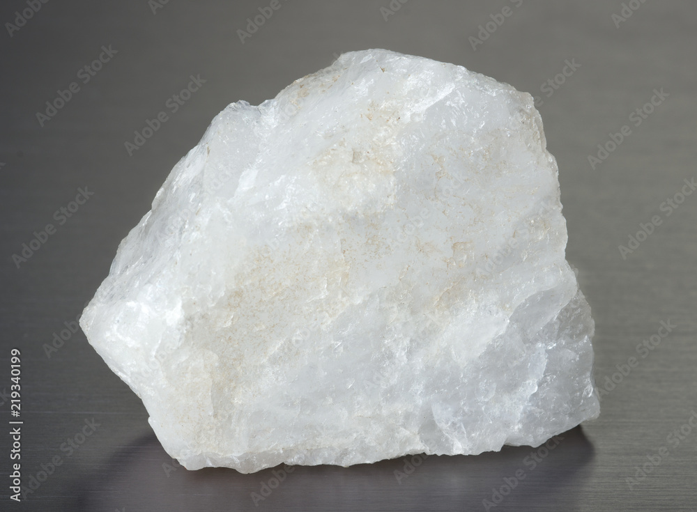 Specimen of mineral quartz on gray background. Quartz crystals have ...