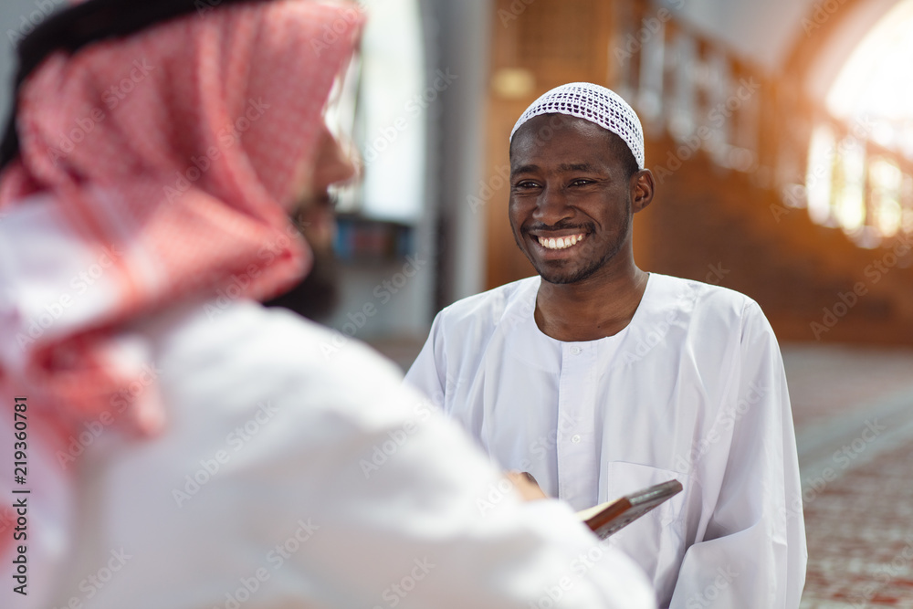 Two religious muslim man praying together inside the mosque Stock Photo ...
