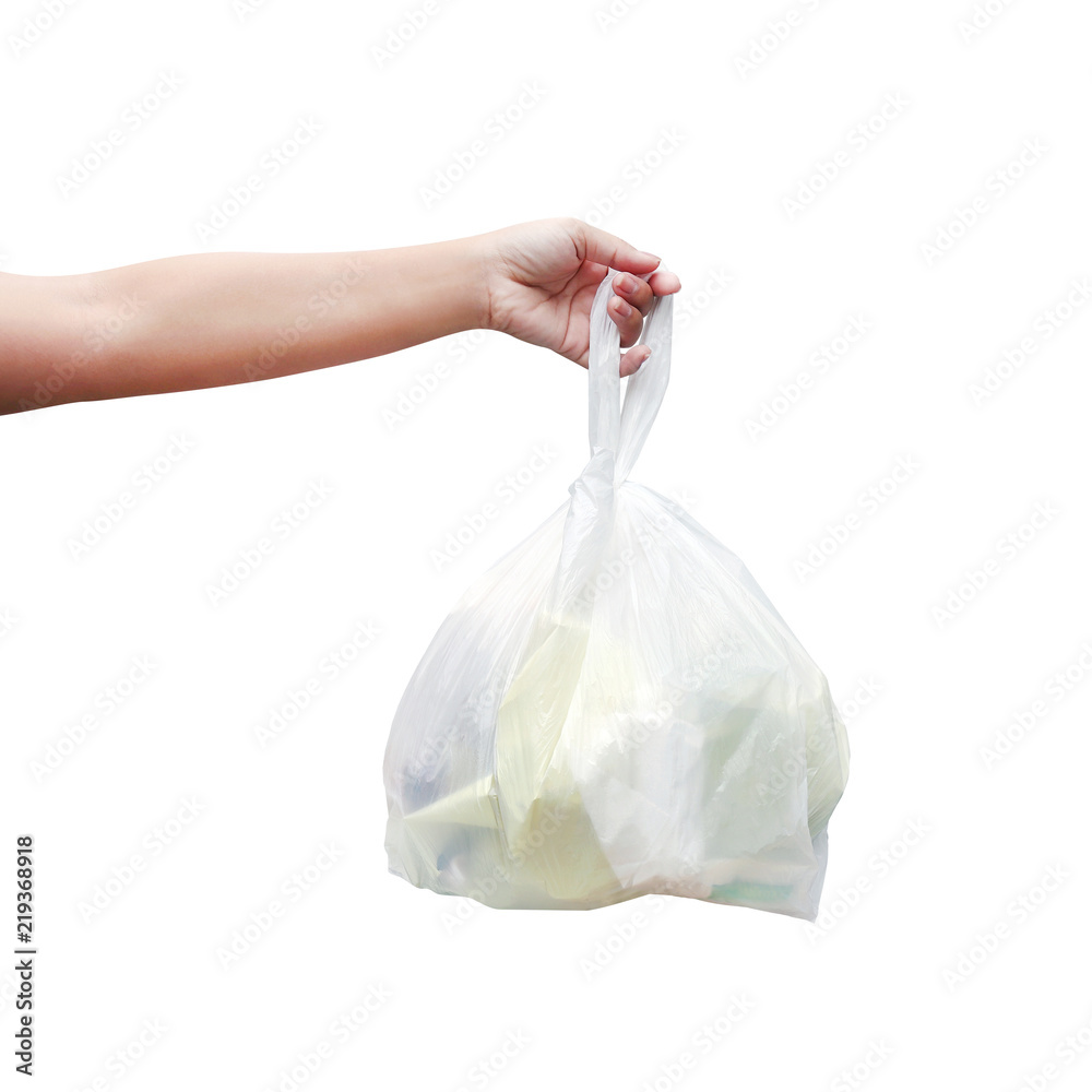 Hand is carrying waste plastic garbage bags isolated white background ...