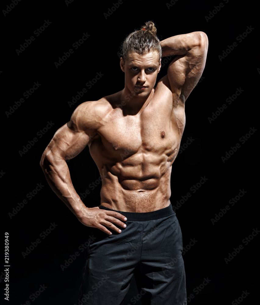 Handsome athletic man posing. Photo of young guy with perfect physique ...