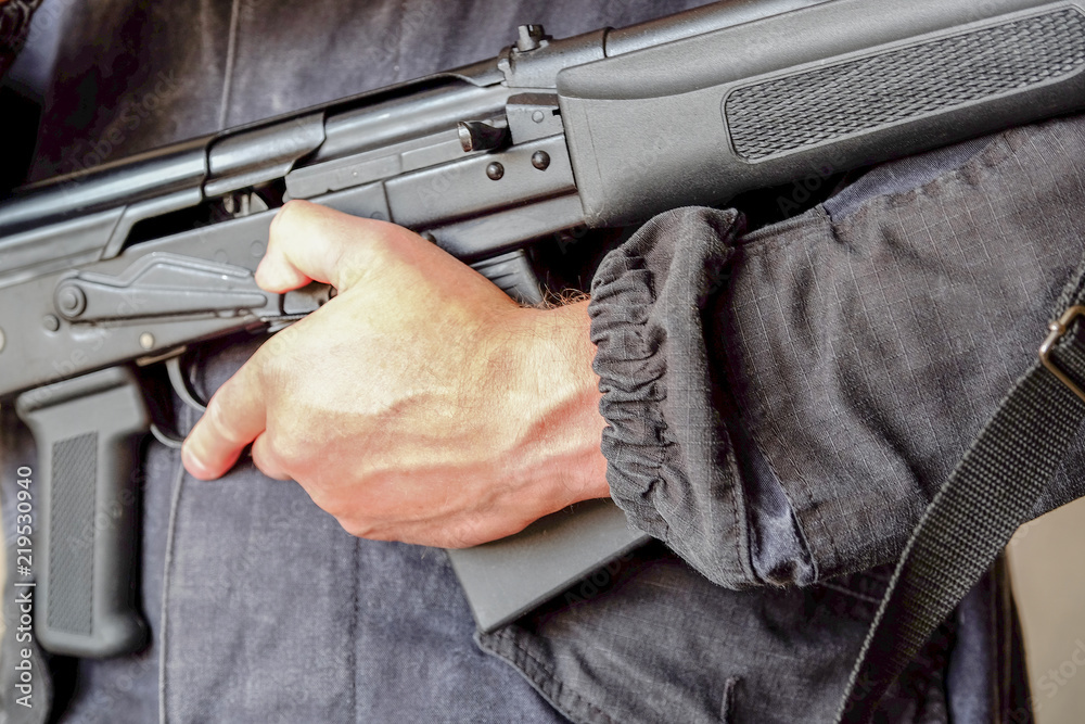 The weapon in his hands. Military, war, conflict, special forces ...