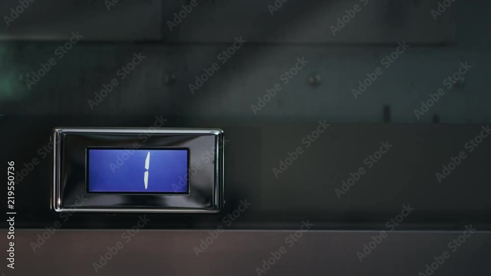 Indicator of direction and movement of lift. Dial with floor number in ...