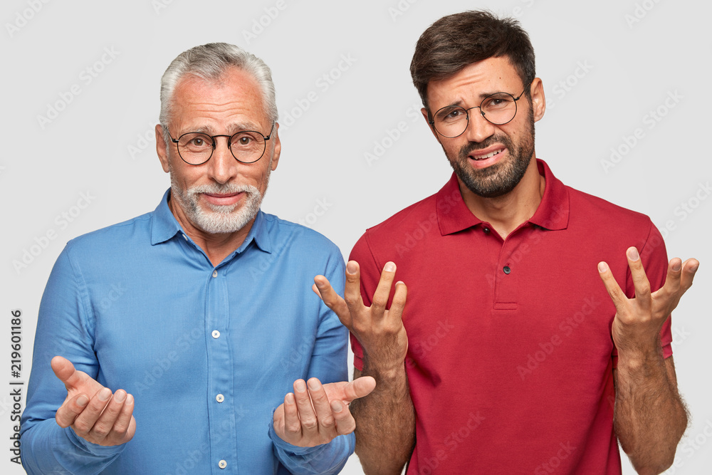 Two uncertain collaborators gesture with hesitation, dont know how ...