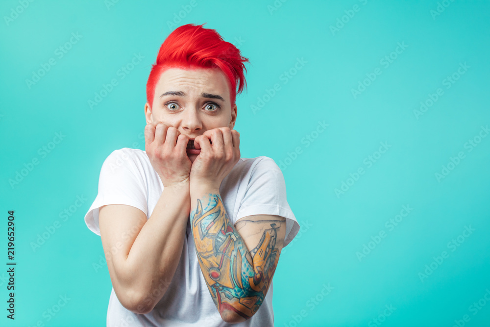 Close up portrait of shocked young woman with stylish hair touching her ...