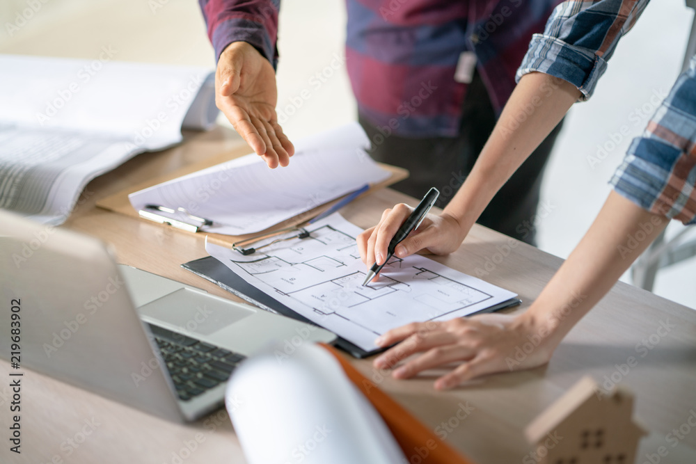 Architect & Engineer working drawing document about project planning ...