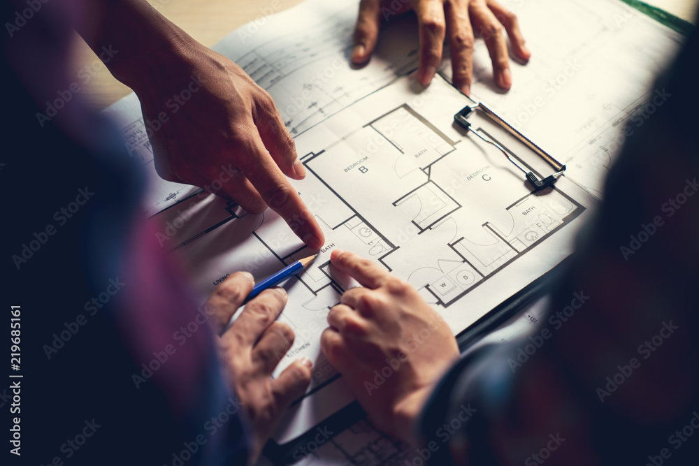 Architect & Engineer working drawing document about project planning ...
