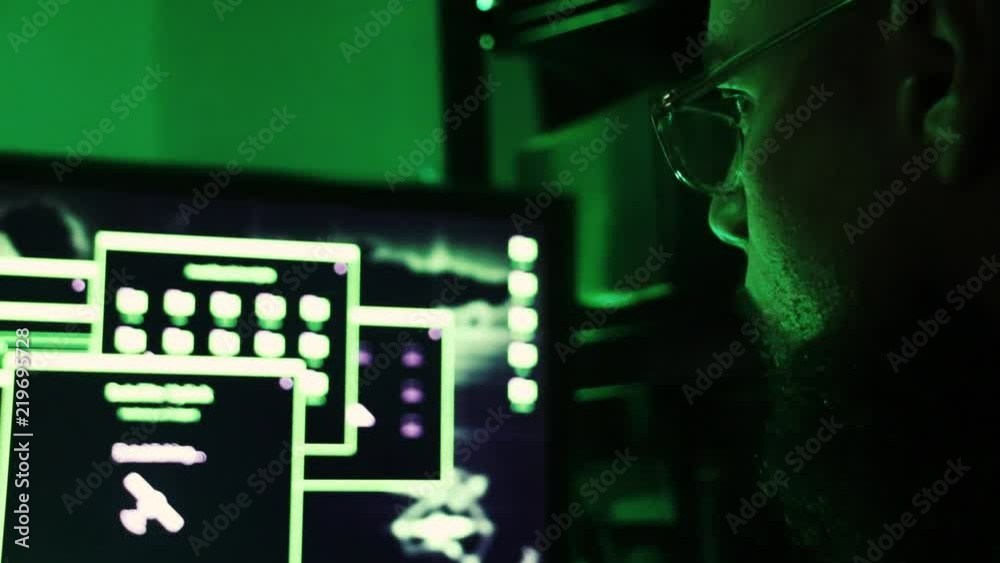 A hacker in front of his screen - stilling all informations from ...