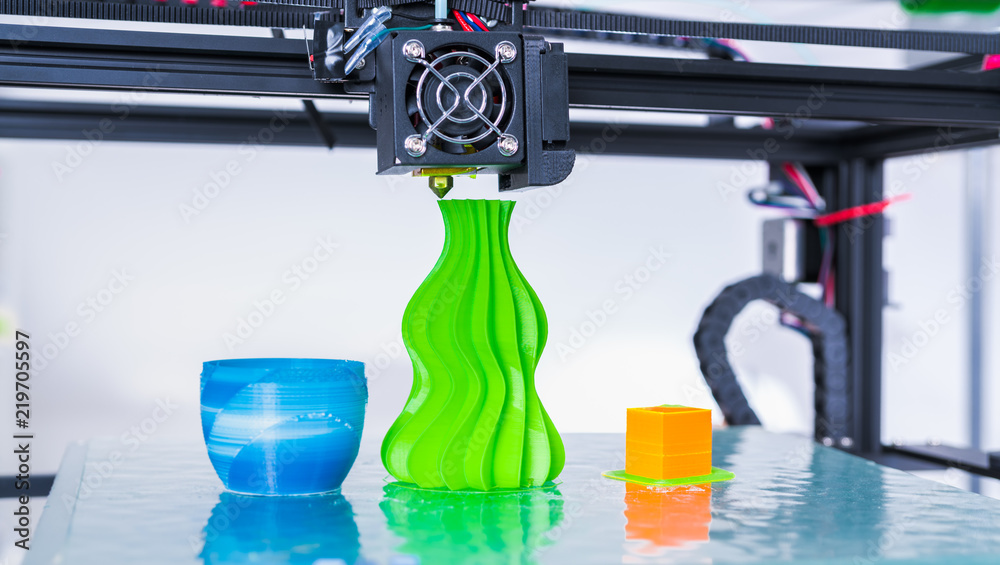 Modern 3D printing.. 3d printer mechanism working during the processes ...
